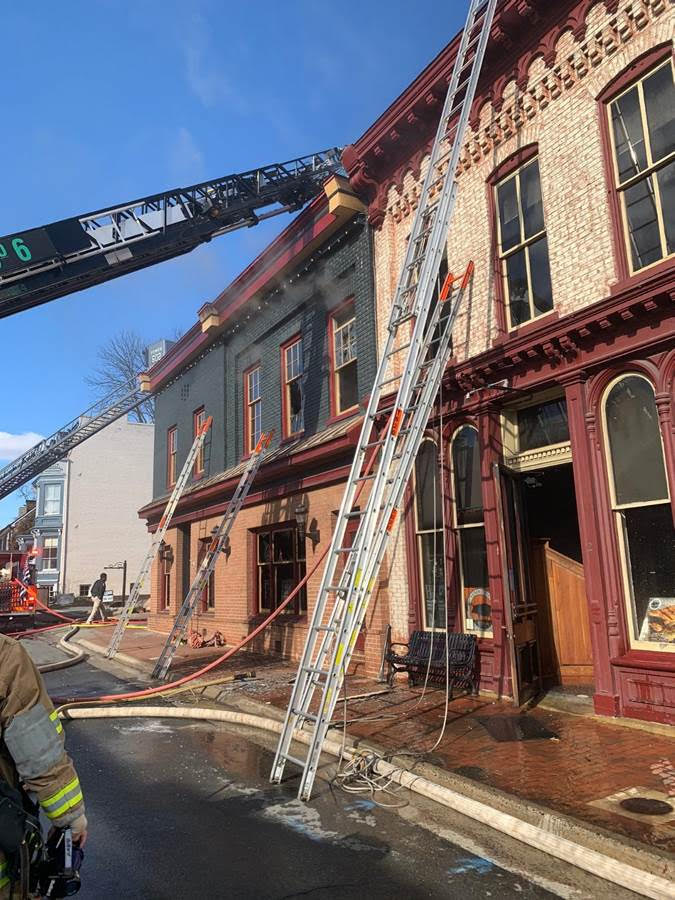 Fire and Rescue Operating on scene of structure fire in downtown ...